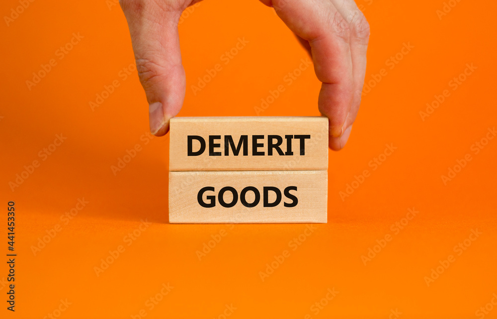 Demerit goods symbol. Wooden blocks with words Demerit goods on ...