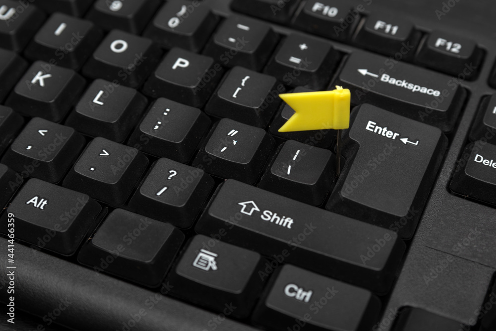 Black computer keyboard and yellow check mark. Important key Enter ...