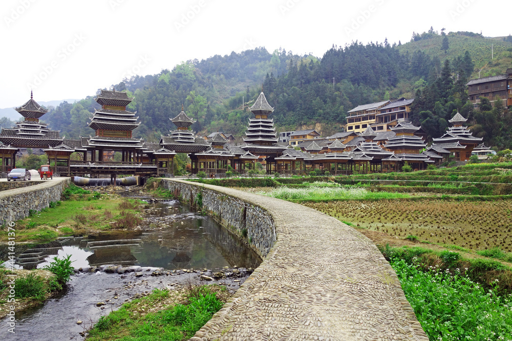 Zhaoxing Dong Zai ancient town (Zhao Xing Village) in the morning mist ...