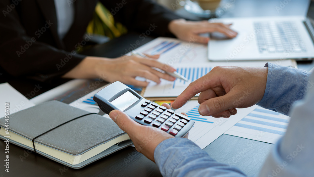 business women and men reading financial reports Businesswomen and men ...