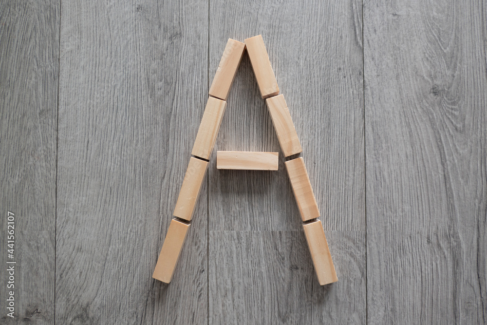 letter A natural wooden blocks on floor alphabet lettering Stock Photo ...