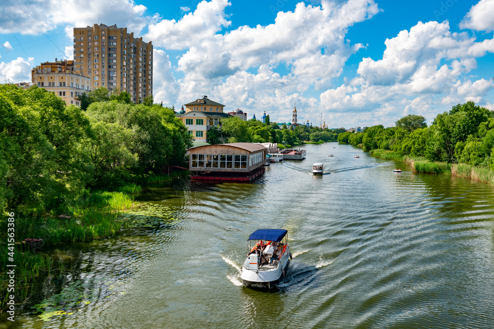 Embankment of the Tsna River in Tambov. Boats on Tsna river in Tambov city. Beautiful view on ...