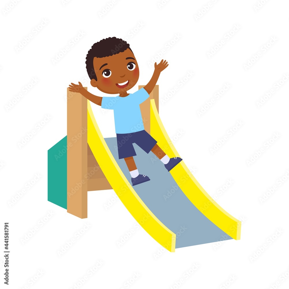 Happy African little boy slides off a children's slide. Joyful dark ...