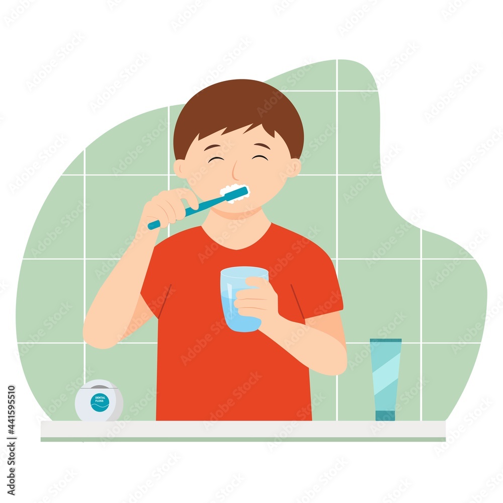 Boy brushing teeth with toothpaste in bathroom. Cute kid clean his ...