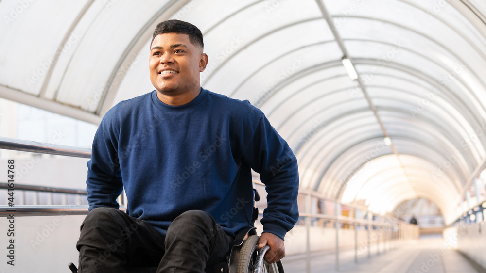 Foto de disabled black man going up the ramp. do Stock | Adobe Stock