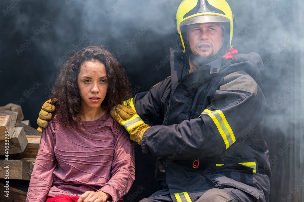 Firefighter emergency rescue help young woman from dangerous smoke and ...