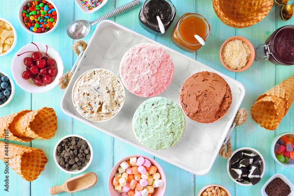 Summer ice cream buffet with different flavors and sweet toppings. Top ...
