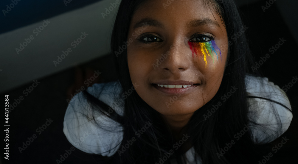 close up portrait of a beautiful dark skinned young girl of LGBTQ ...
