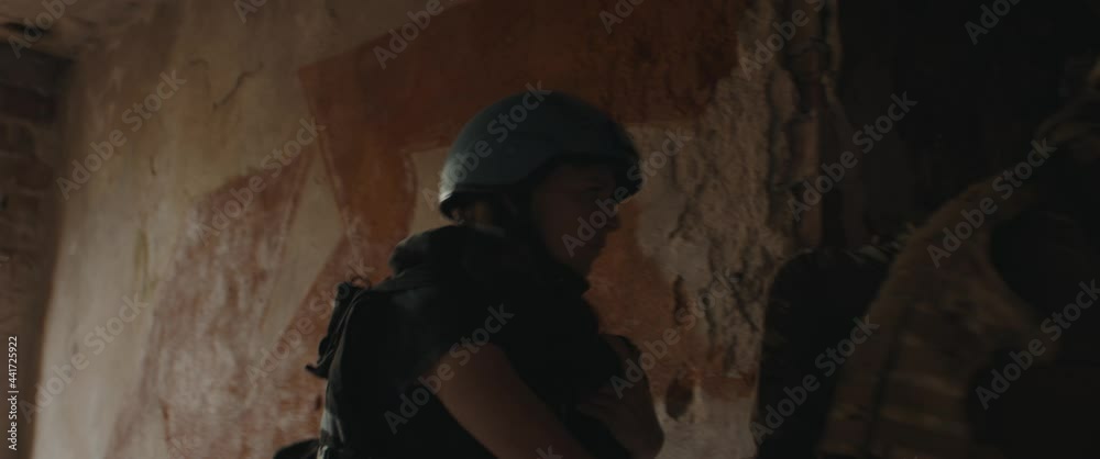 Caucasian female war journalist wearing protective helmet and ...