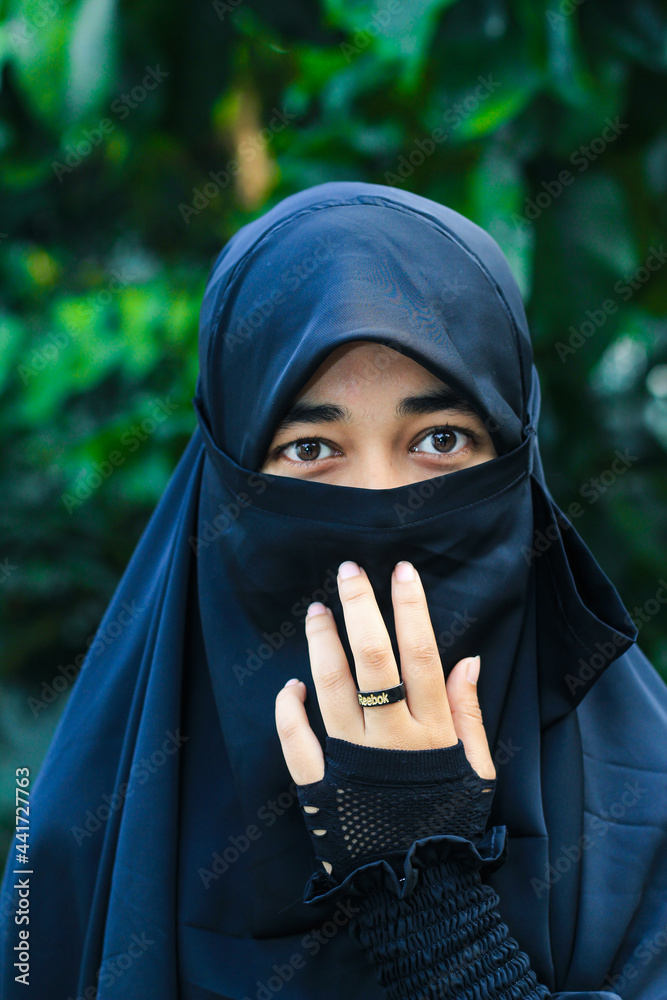 Closeup of beautiful woman face covered with hijab. Perfect shiny eyes ...