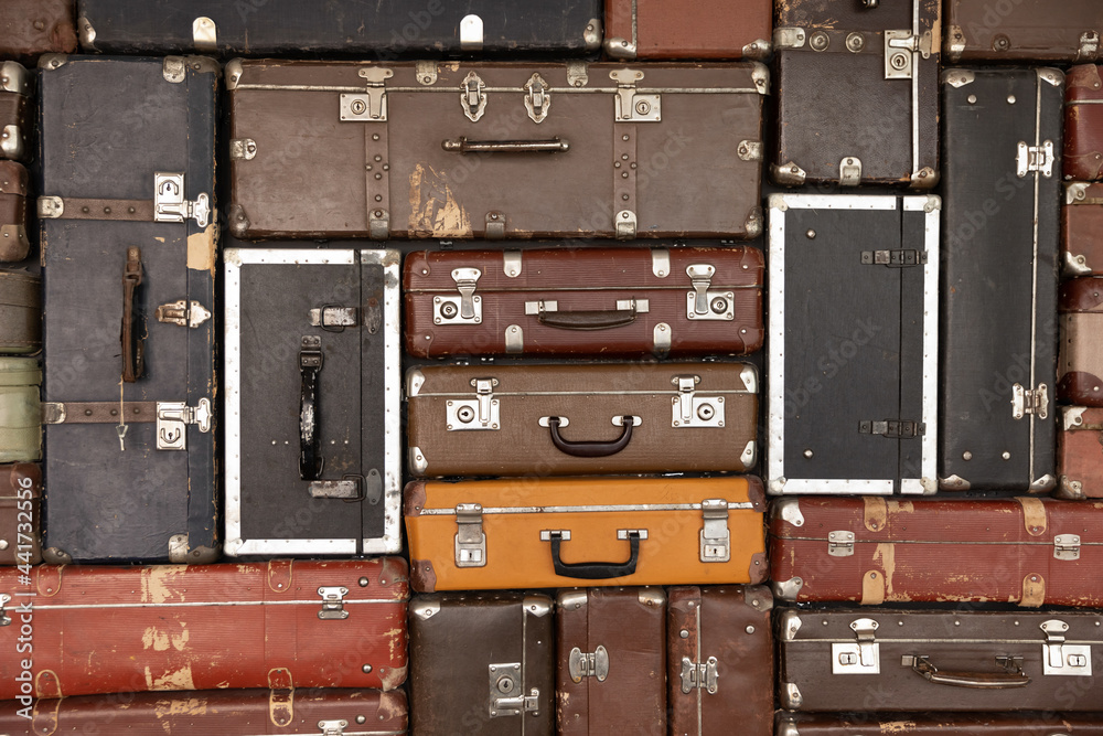 Wallpaper banner with folded old-fashioned antique leather suitcases ...