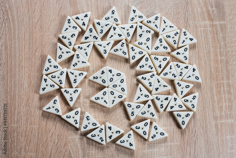 Triangular elements with numbers from the board game trimino. Top view ...