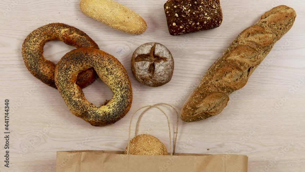 Bread. Stop motion. Gradually, loaves of bread are laid out from the ...