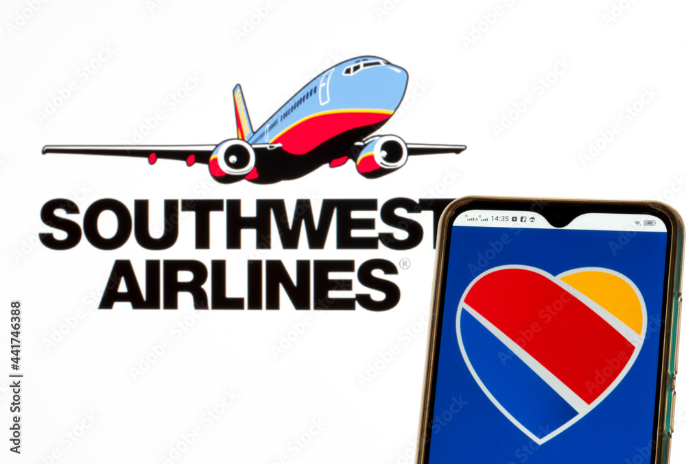 In this photo illustration a Southwest Airlines Co. logo seen displayed ...