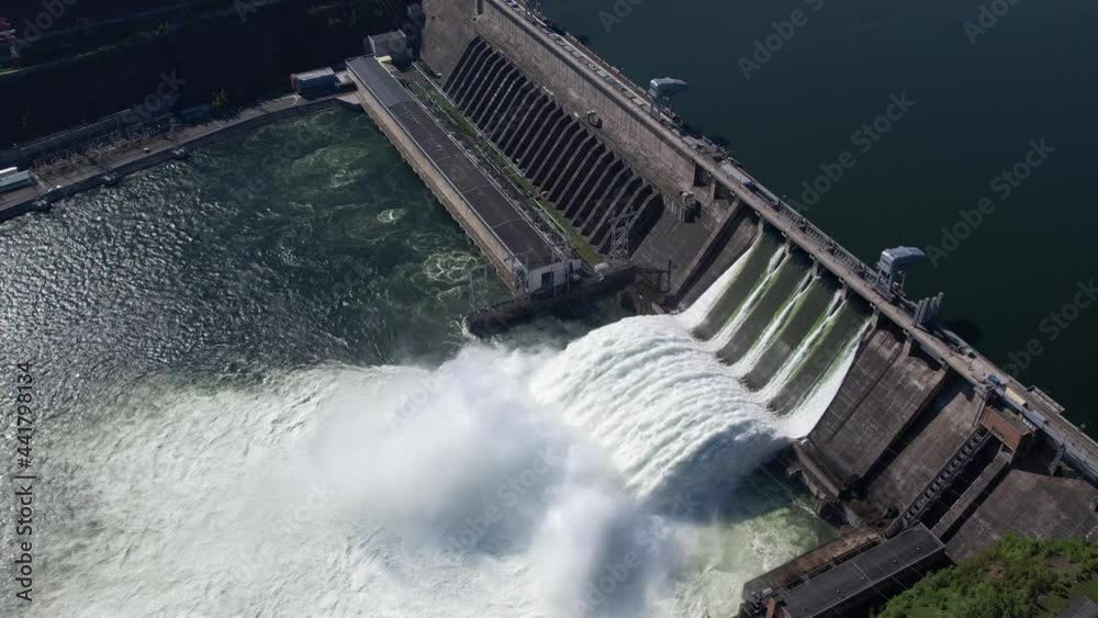 Hydroelectric dam on the river, water discharge from the reservoir ...