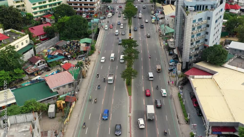 Urban landscape of the city of Manila with heavy traffic on the highway ...