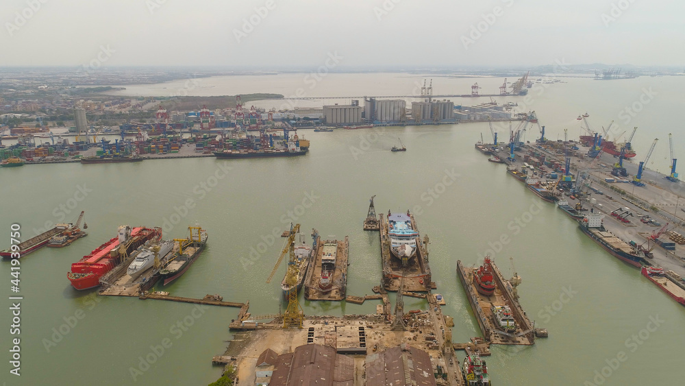 aerial view cargo and passenger seaport with ships and crane Tanjung ...