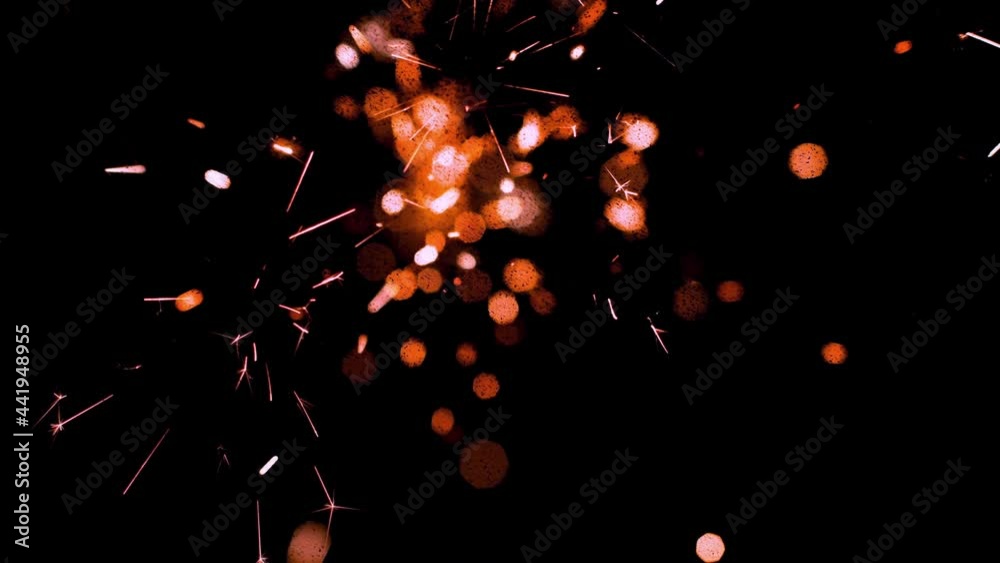 Fire sparks rising up with black background can be used for overlay for ...