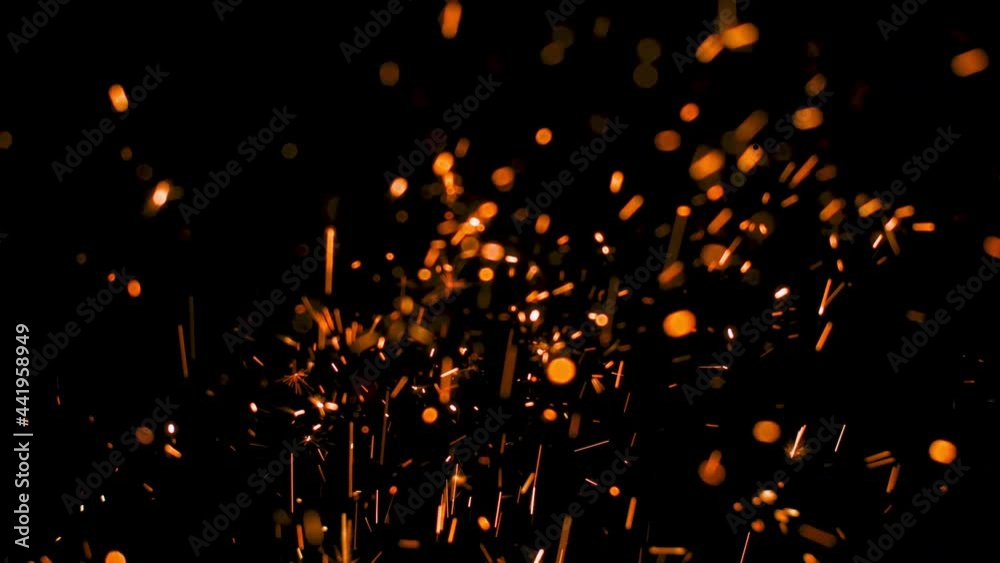 Fire sparks rising up with black background can be used for overlay for ...