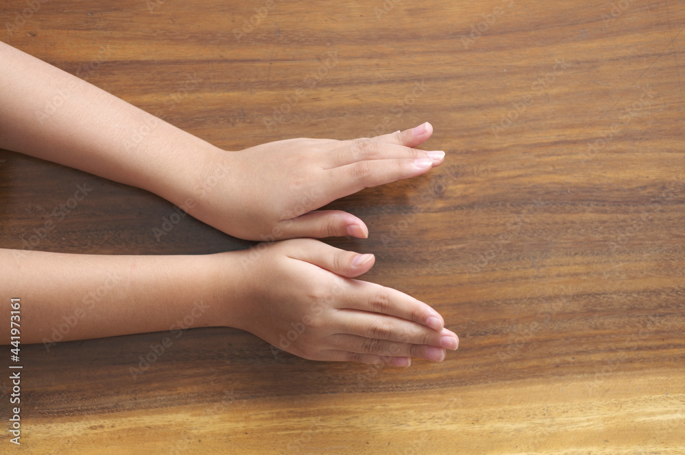Two hands facing downwards, showing back of hand. Palm down, dorsal ...