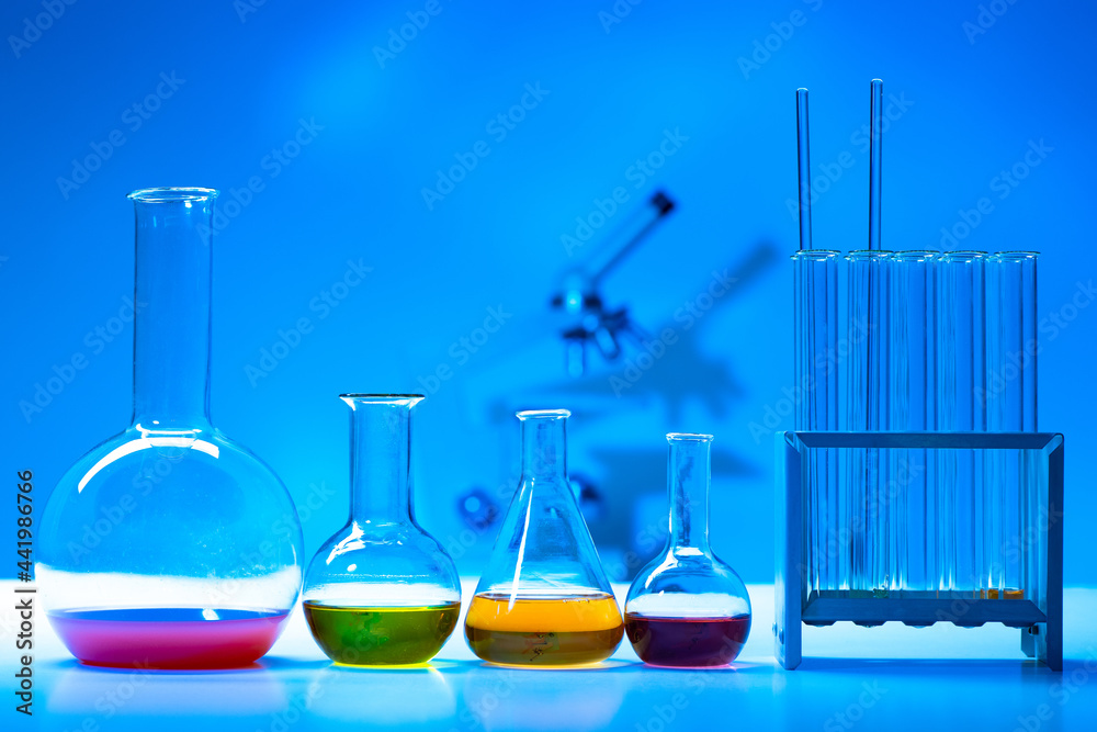 Laboratory glass. Test tubes with multi-colored liquids. They symbolize ...