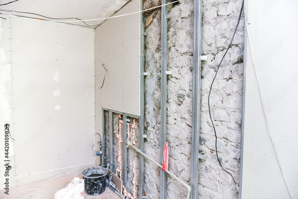 Renovation inside a residential building, installation of plasterboard ...
