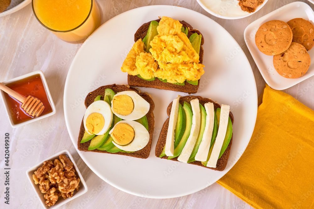 healthy low calorie breakfast, 3 slices of toast with avocado, cheese ...