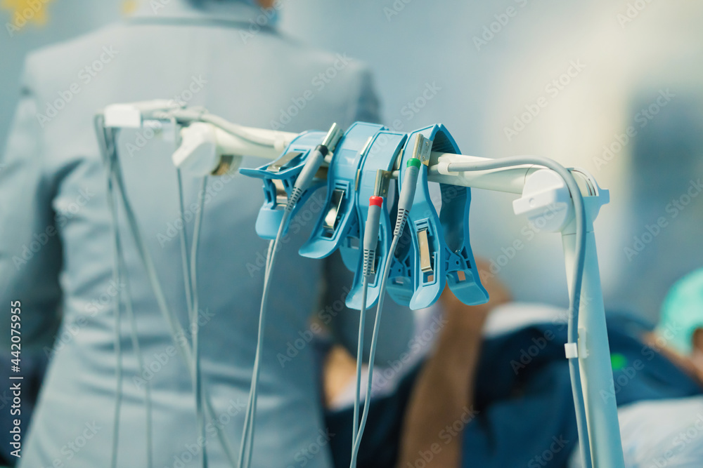 ECG or EKG of man with electrodes for electrocardiogram records on bed ...