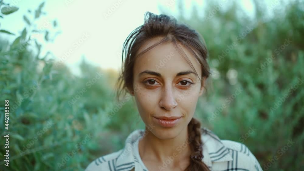 Front close up of mixed race woman, natural human face with tunned skin ...