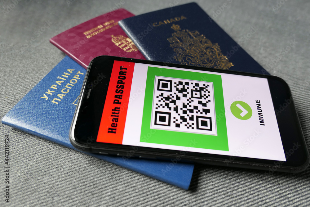 smartphone with digital health passport app with three passports for ...