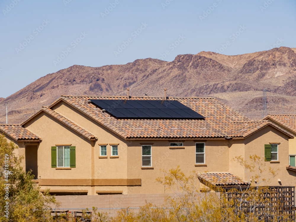 Sunny view of a two stories house with solar panel Stock Photo | Adobe ...