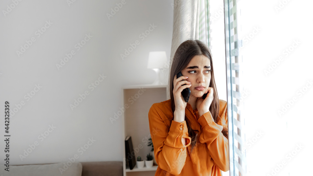 Cropped shot of a young business woman looking stressed using smart ...