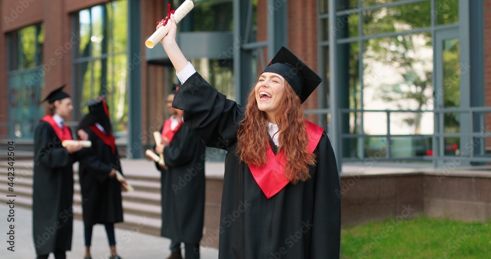 Young graduated girl holding her graduation degree convocation ceremony ...