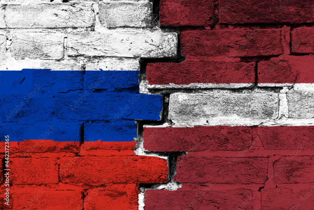 Concept of the relationship between Russia and Latvia with two painted ...