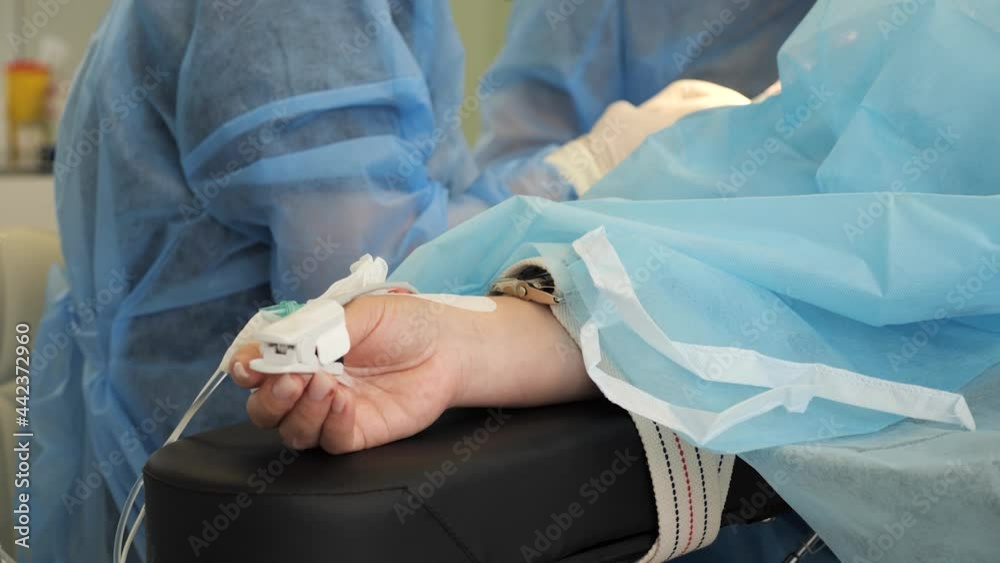 Healthcare medicine concept patient's hand with an IV lying on the ...
