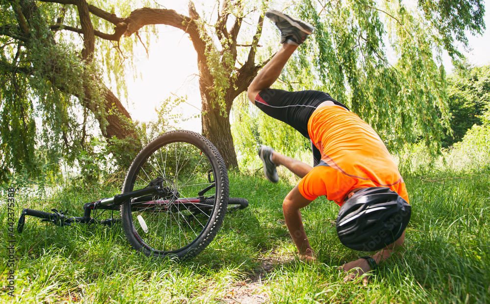 Man falling from the bike on the pathway in the countryside Stock Photo ...