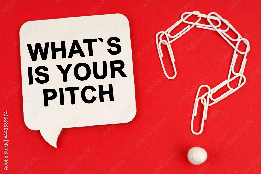 On a red background are a question mark made of paper clips and a sign ...