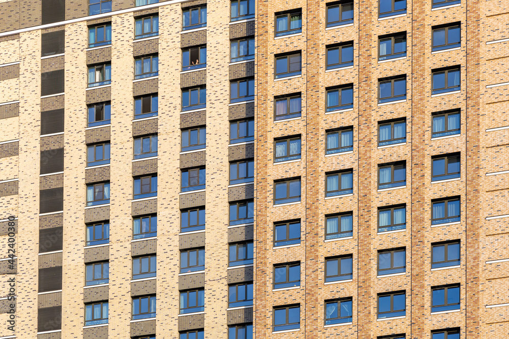 Lots of windows on the facade of a modern residential high-rise ...