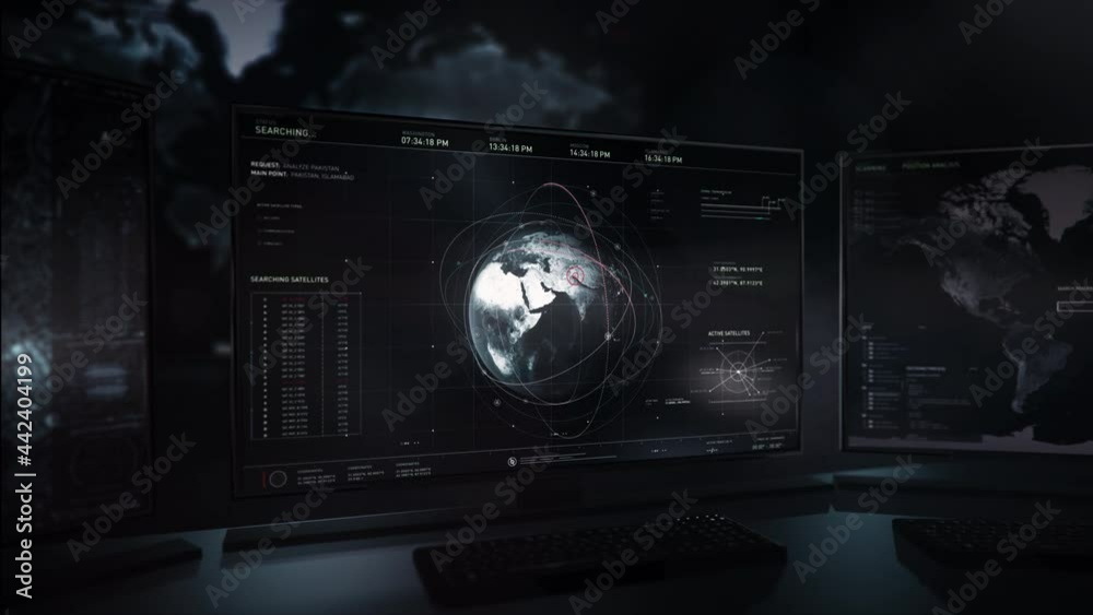 Three computer monitors on desk. Searching satellites. Tracking ...