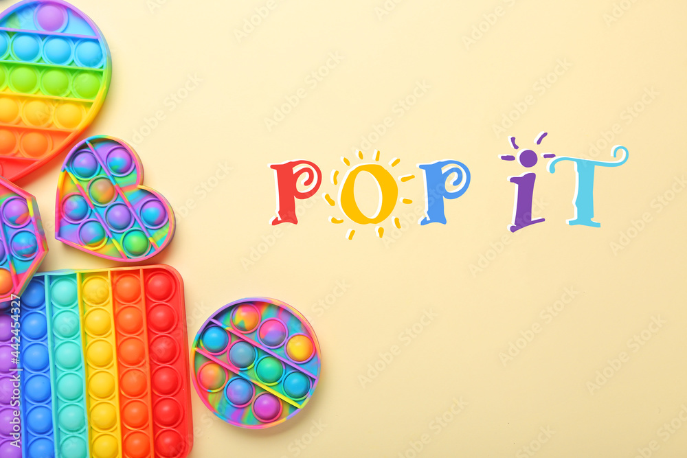 Bright fidget toys on color background Stock Photo | Adobe Stock