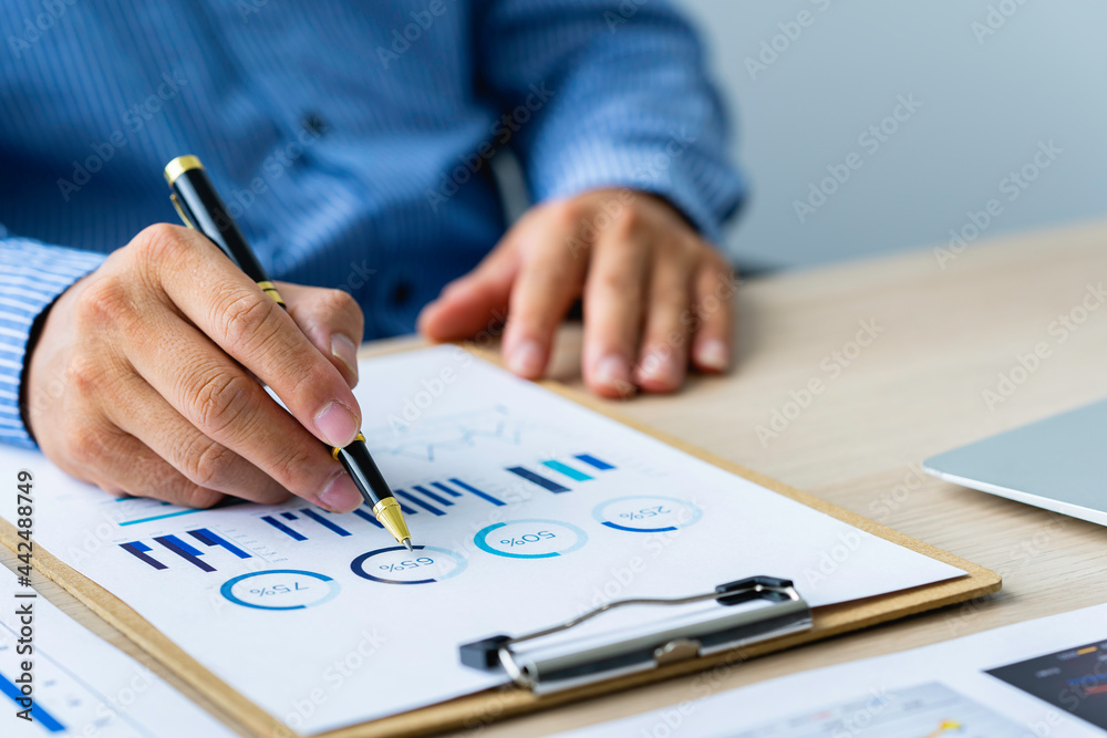 Close up account man hand using calculator for calculate and writing ...