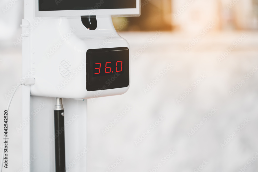 temperature digital scanner machine showing temperature on blurred ...