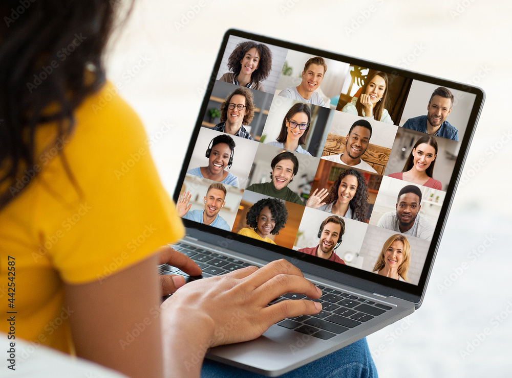 Online Conference. Unrecognizable black woman using laptop for group ...