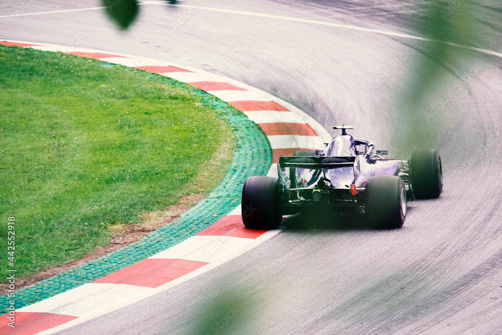 F1 race car on the racing track, driving into the corner, GP, Grand ...