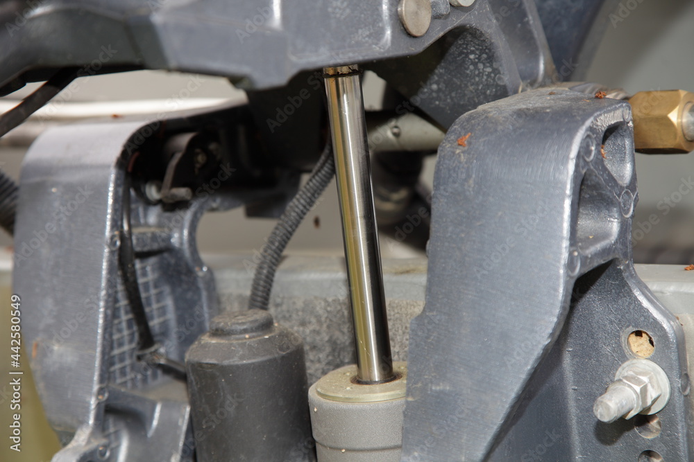 Motor boat outboard motor lower unit power trim and tilt cylinder with ...