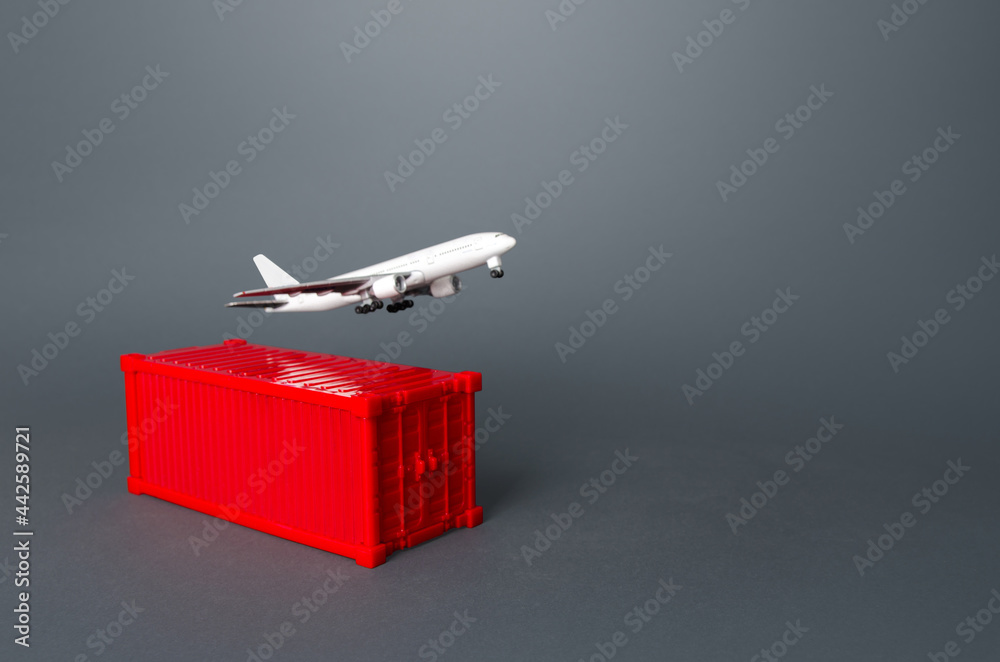 Cargo plane over red ship container. Services of express delivery and ...