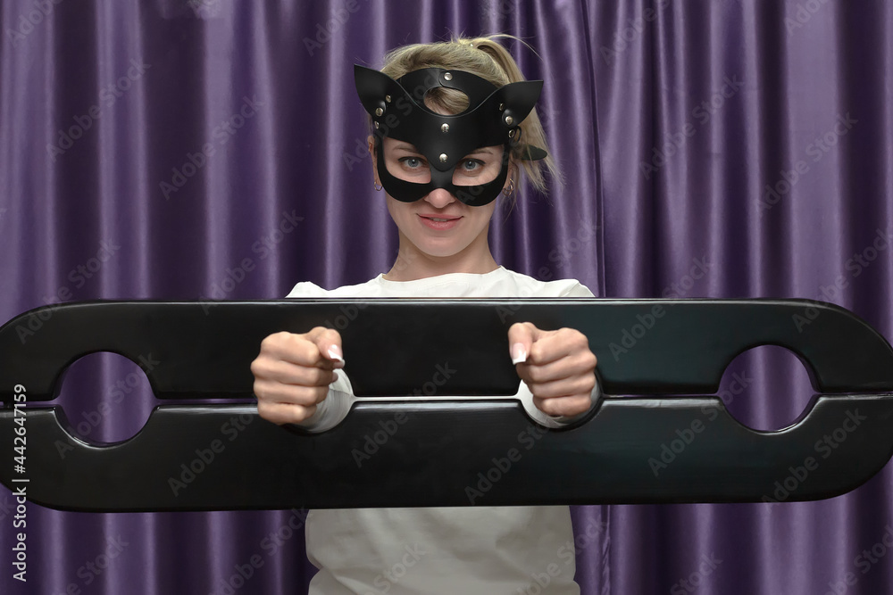 Beautiful pretty girl in wooden black shackles, BDSM Stock Photo ...