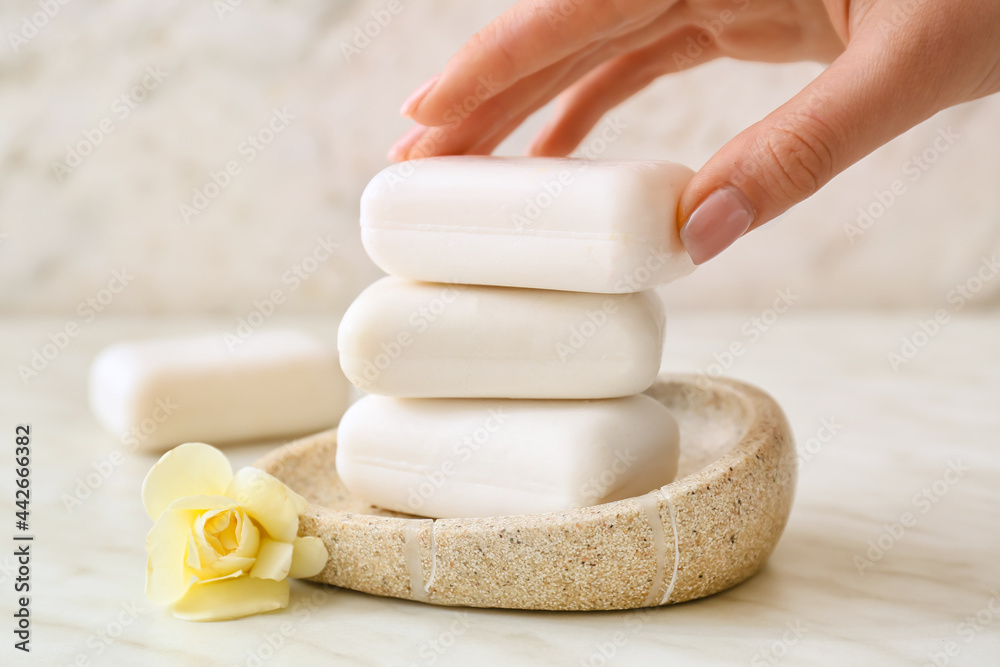 Female hand with soap bars on light background, closeup Stock Photo ...