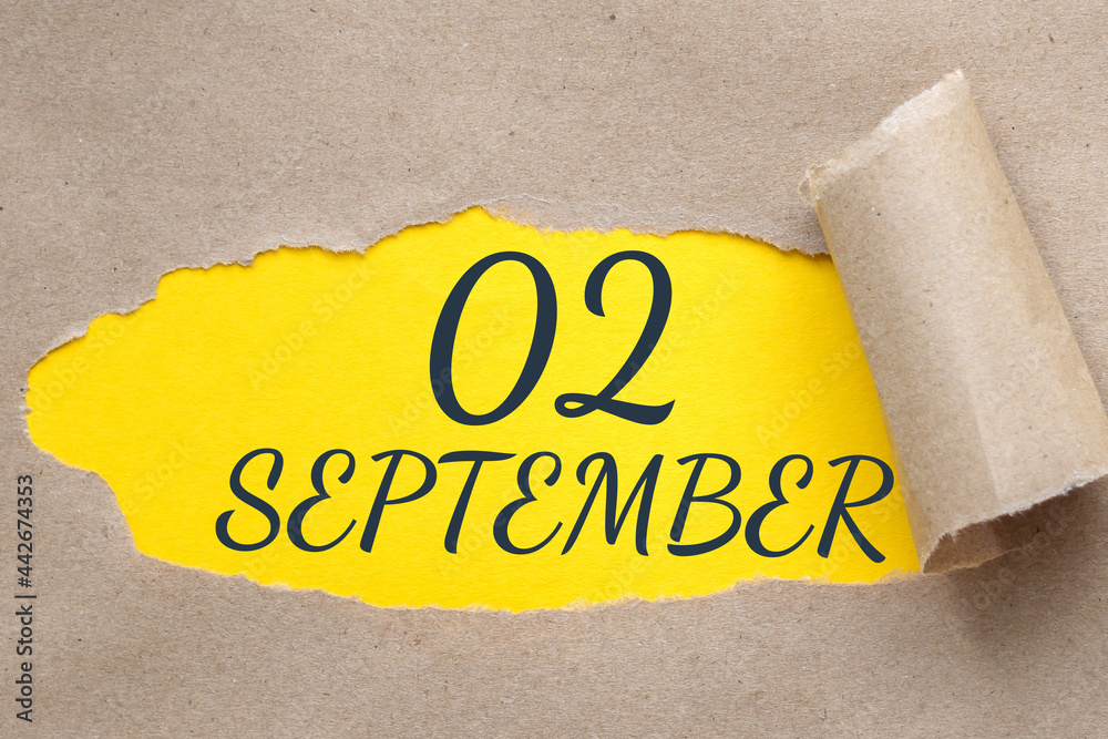 september 02. 02th day of the month, calendar date.Hole in paper with ...