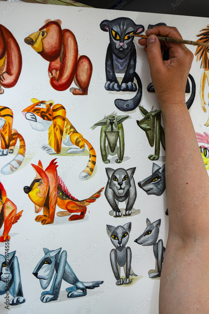 The animator draws with a pencil and draws characters from cartoons ...